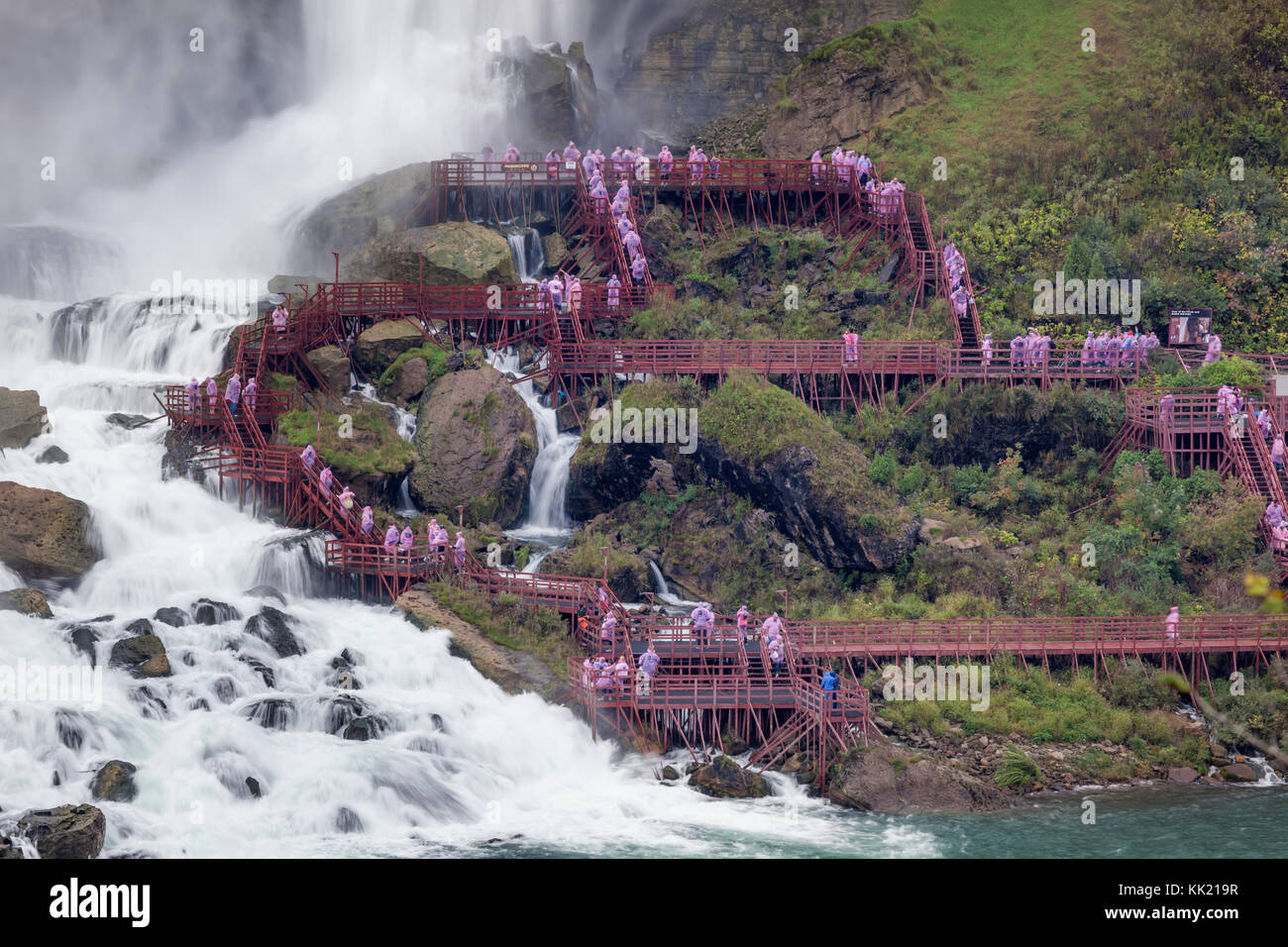 Tourists climbing the stairs down to the Waterfalls viewing platform ...