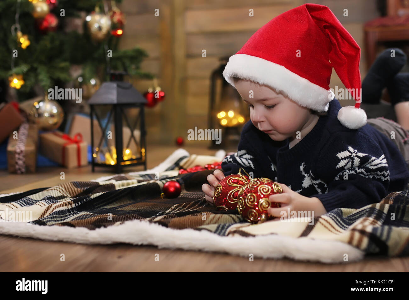 little child and Christmas toys Stock Photo - Alamy