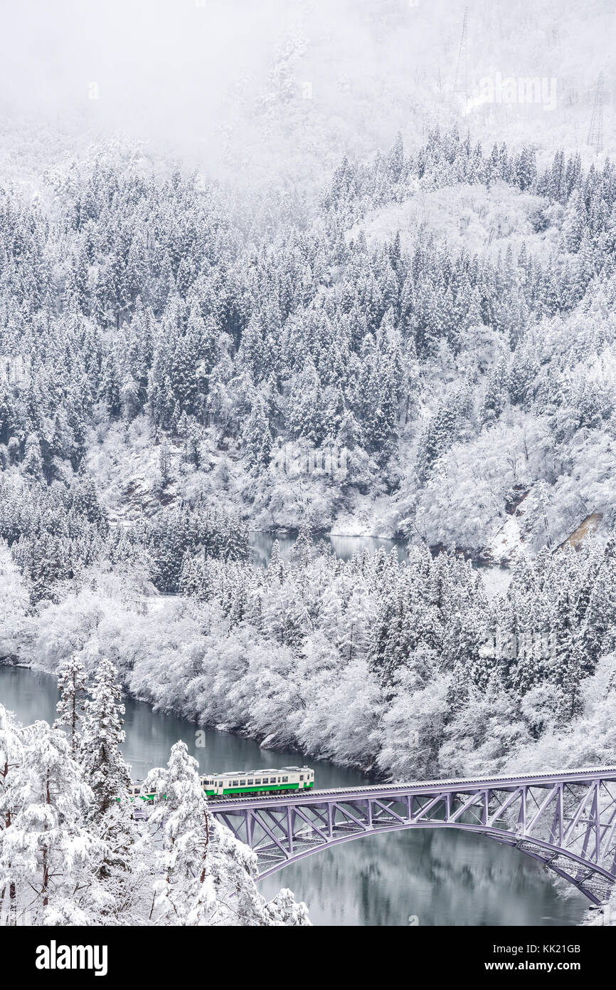Winter landscape snow covered trees with train crossin River on Bridge ...