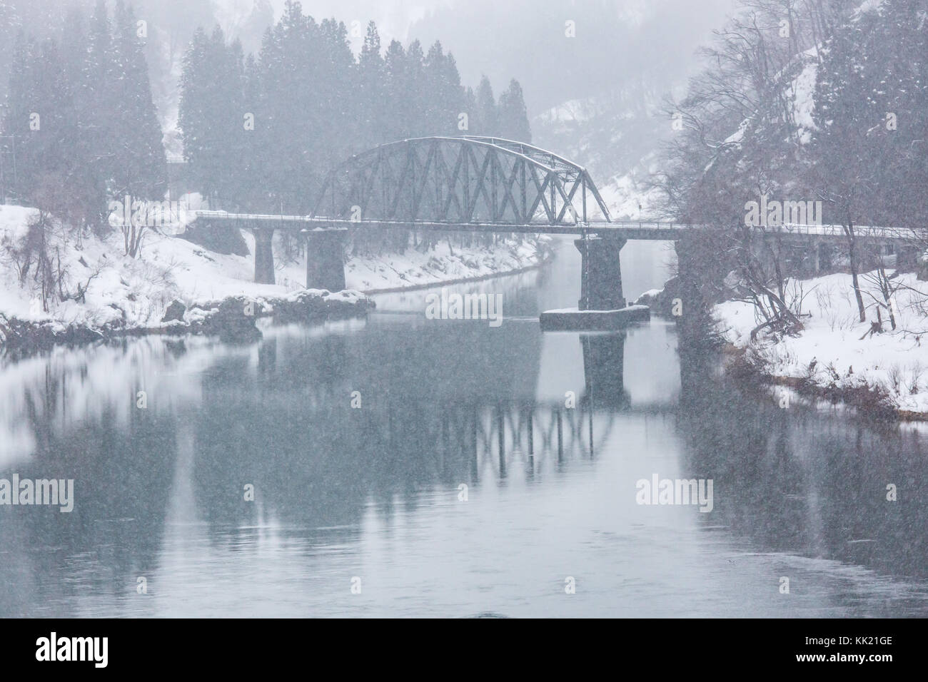 Train in Winter landscape snow on bridge Stock Photo - Alamy