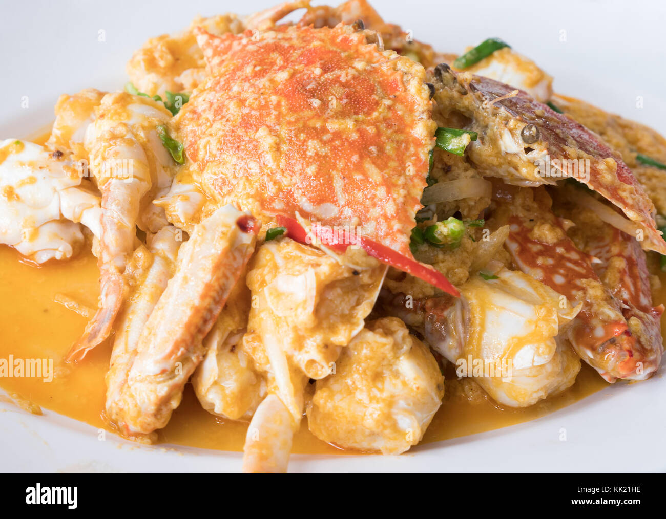 Fried crab with curry powder on the white plate for serve in the Thai ...