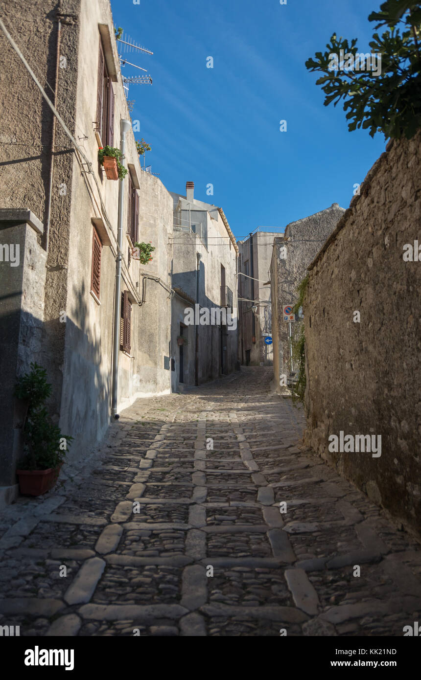Narrow ancient cobblestone street of medieval town Erice, Sicily, Italy ...