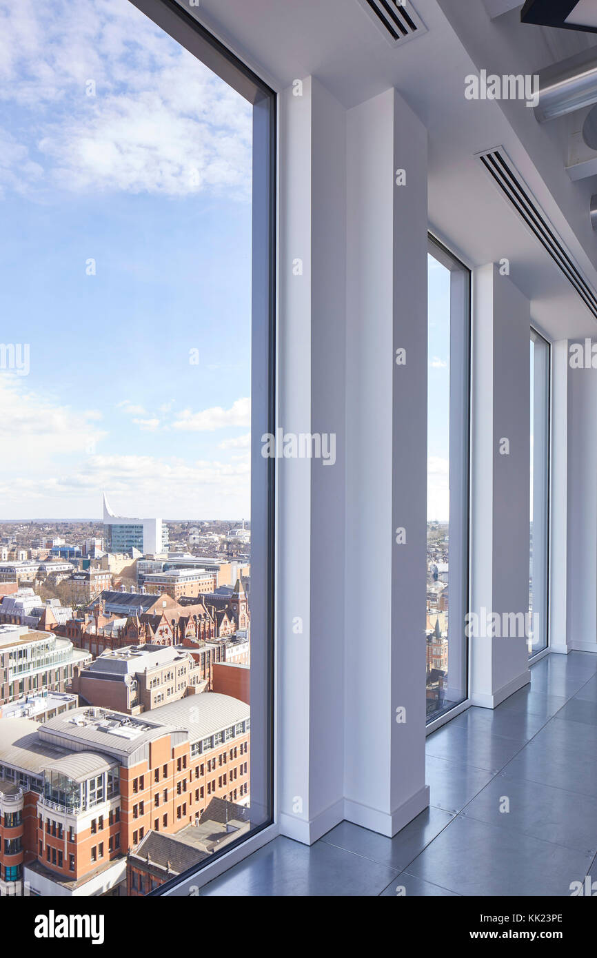 City view through window wall on upper floor. Thames Tower, Reading ...
