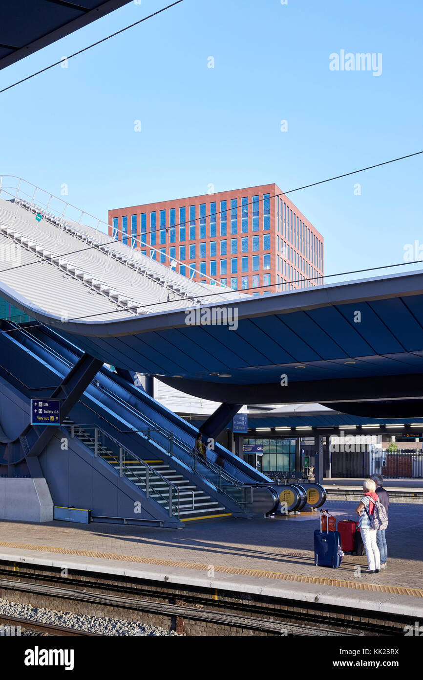 Distant view from station platform towards terracotta clad tower ...