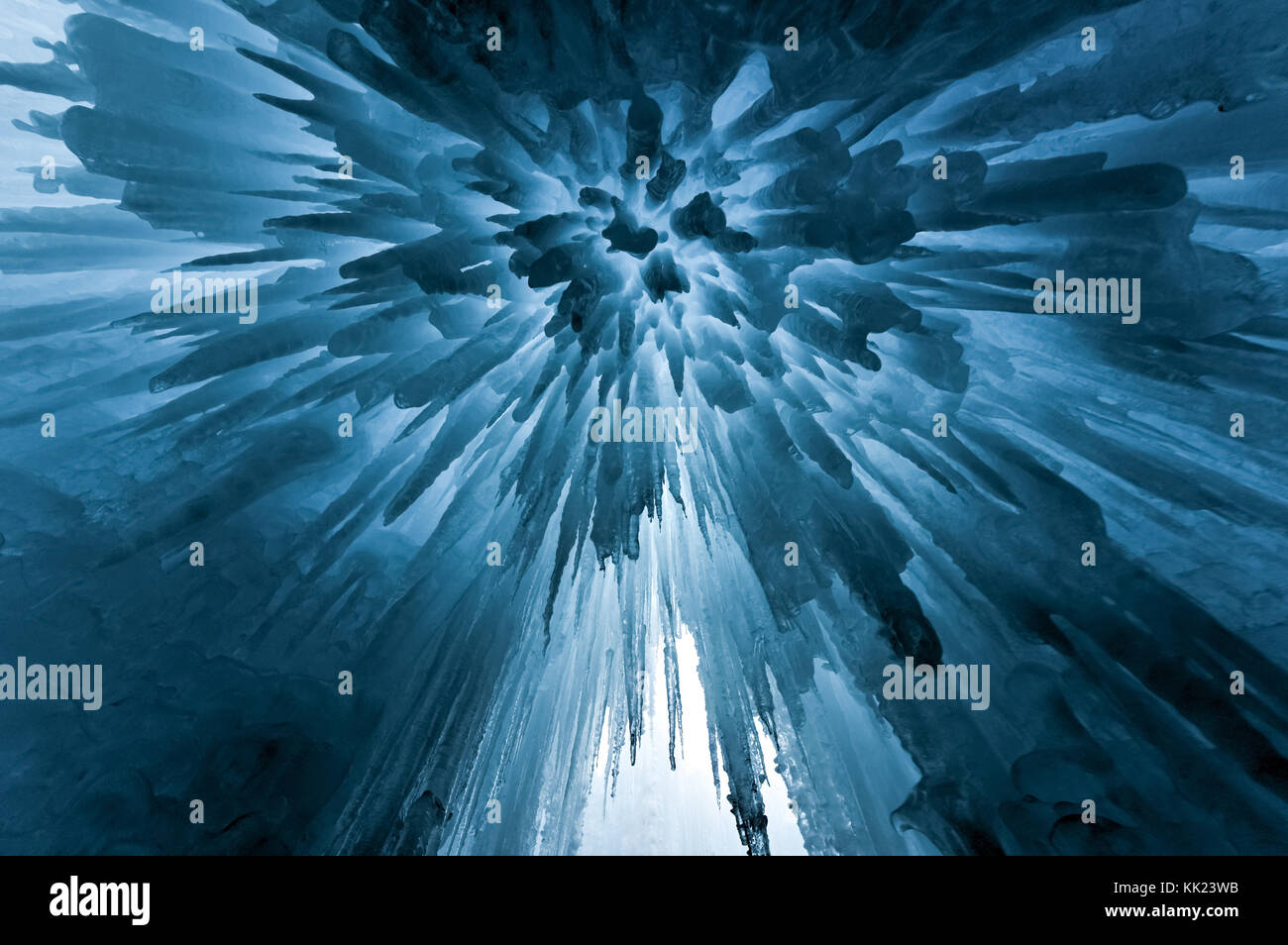 Translucent blue icicles in a frozen ice wall Stock Photo - Alamy