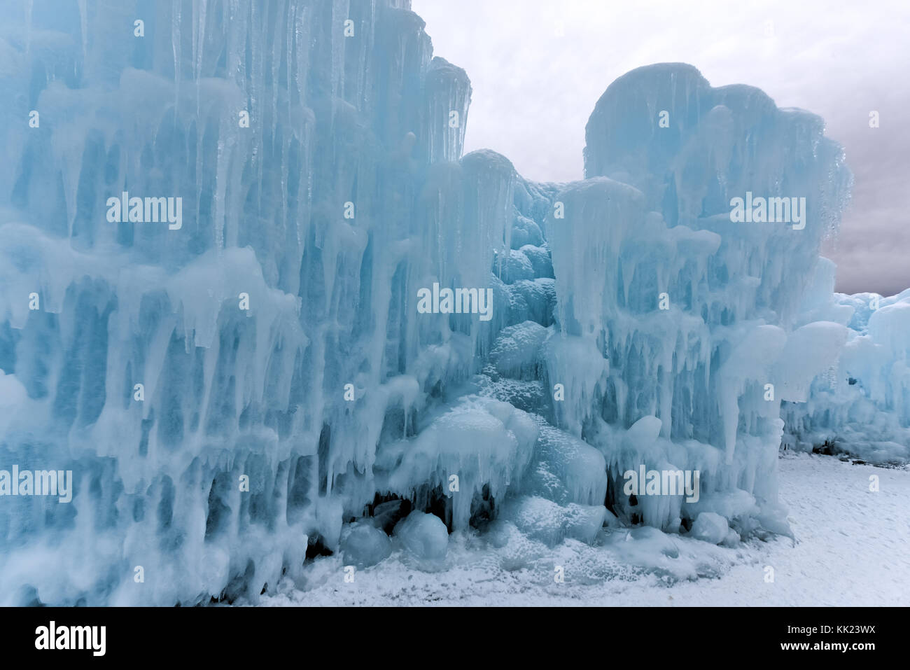 Translucent blue icicles in a frozen ice wall Stock Photo - Alamy