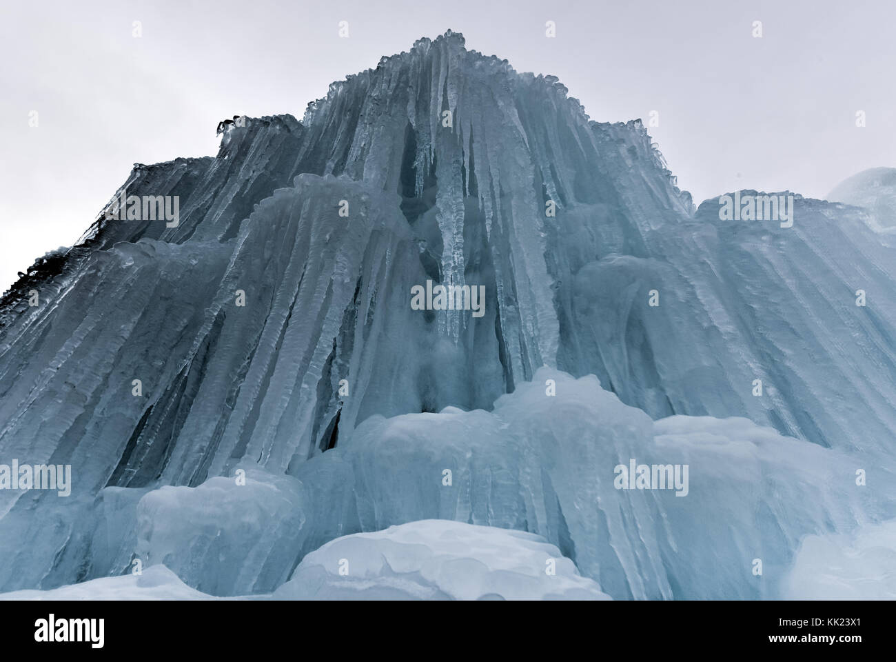 Translucent blue icicles in a frozen ice wall Stock Photo - Alamy