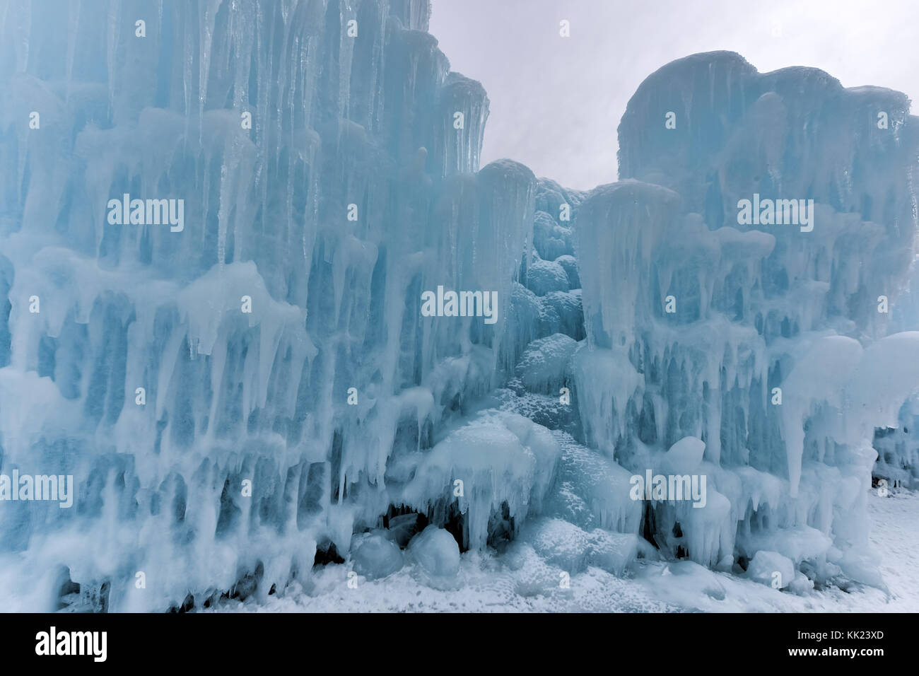 Translucent blue icicles in a frozen ice wall Stock Photo - Alamy