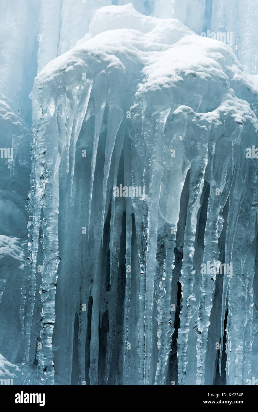 Translucent blue icicles in a frozen ice wall Stock Photo - Alamy
