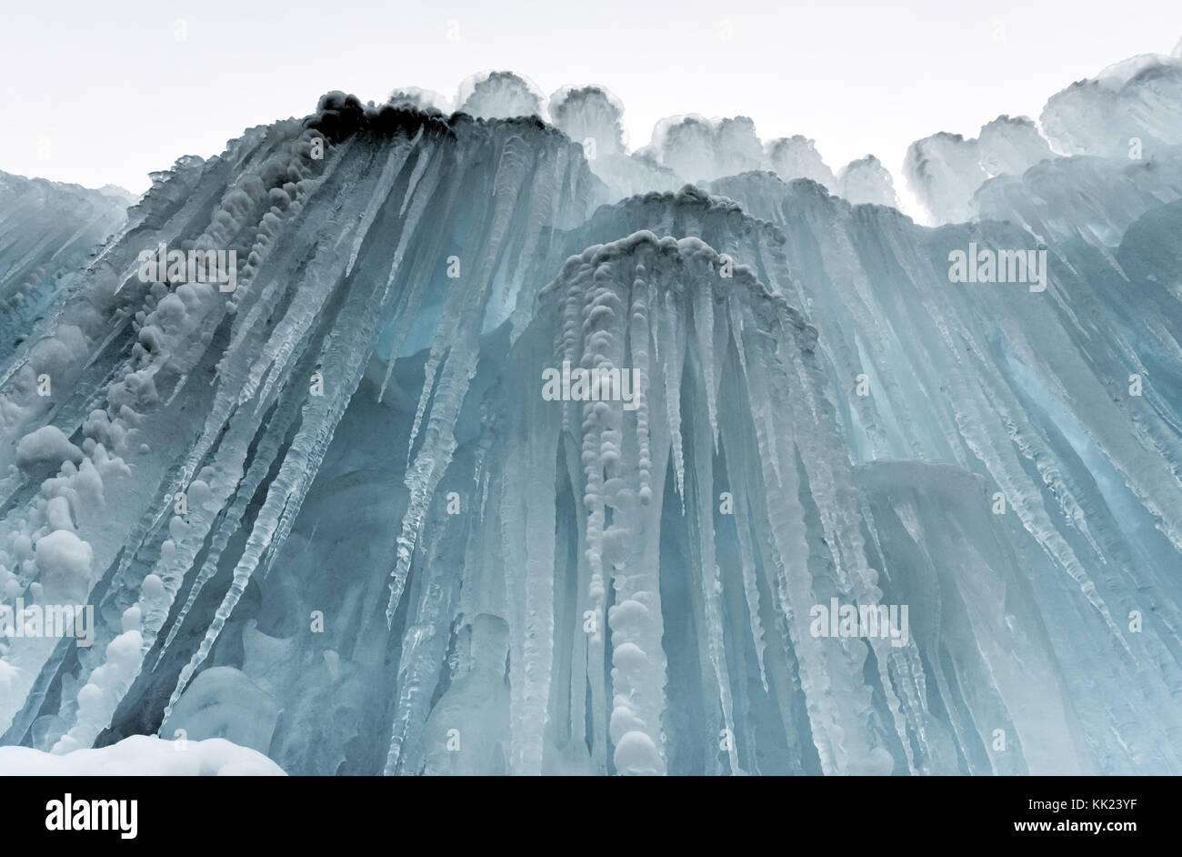 Translucent blue icicles in a frozen ice wall Stock Photo - Alamy