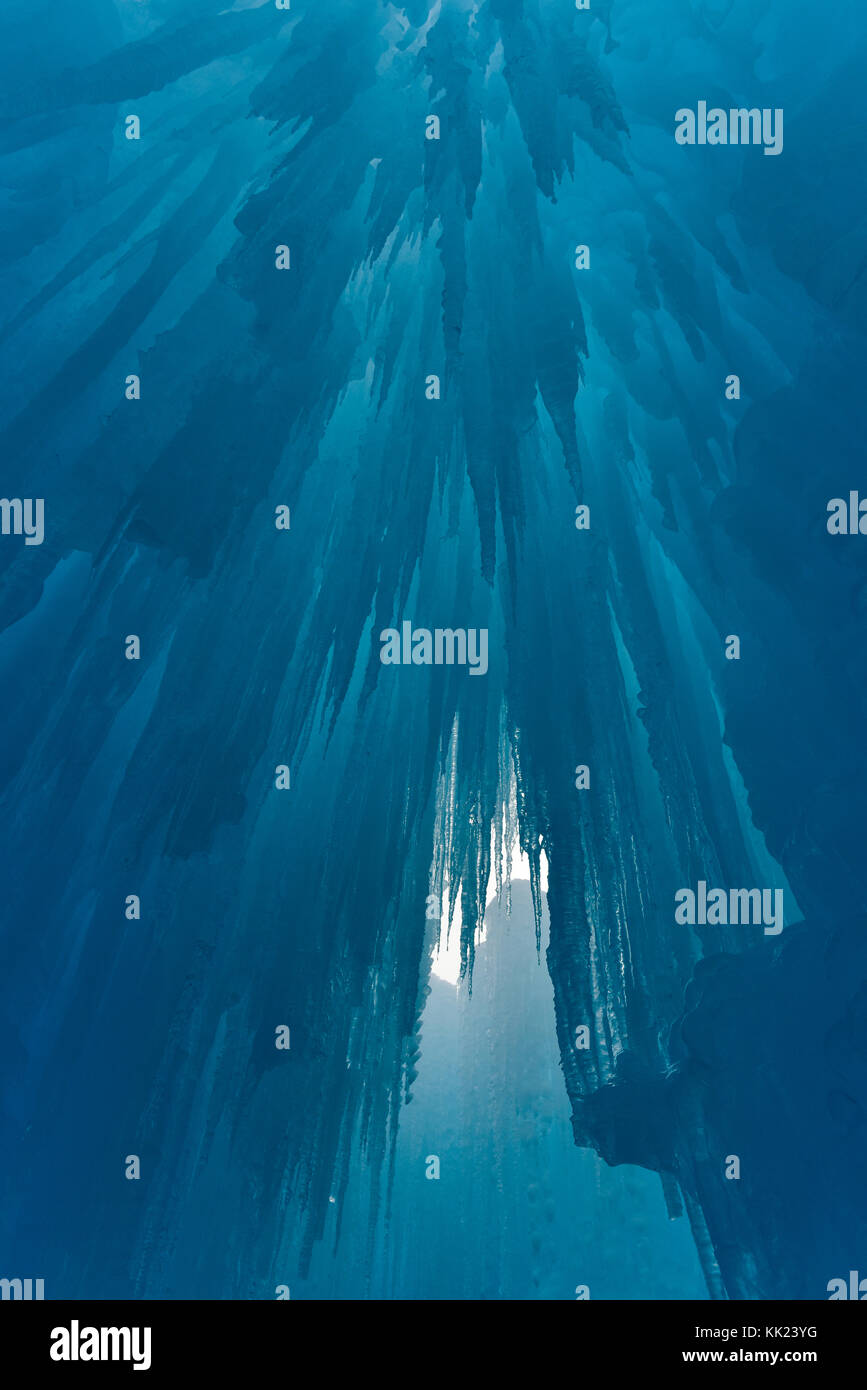 Translucent blue icicles in a frozen ice wall Stock Photo - Alamy