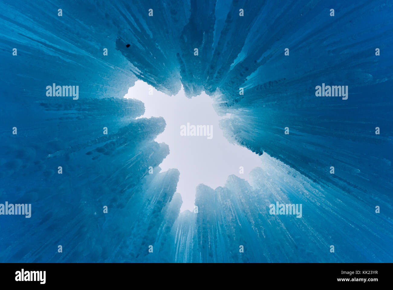 Translucent blue icicles in a frozen ice wall Stock Photo - Alamy