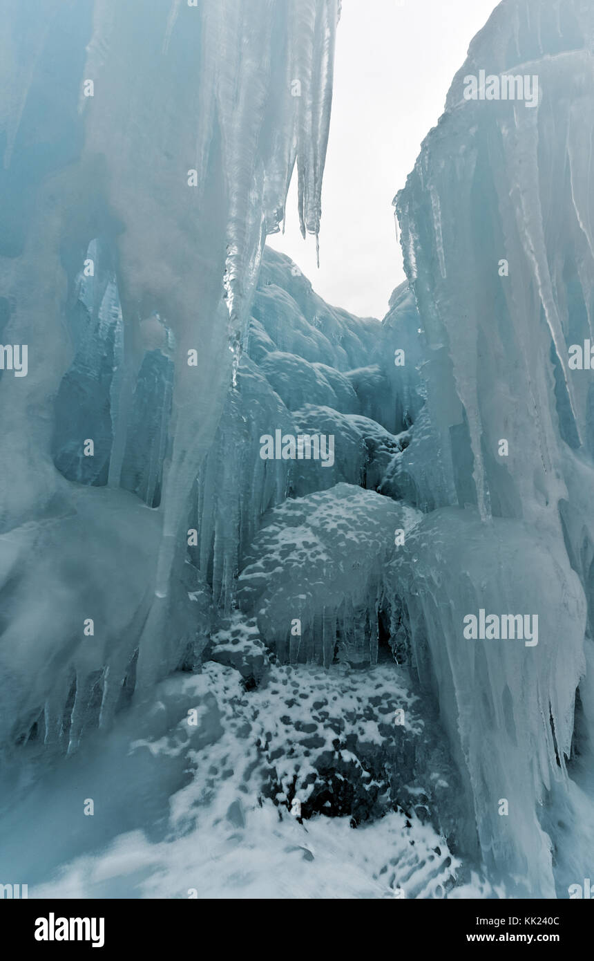 Translucent blue icicles in a frozen ice wall Stock Photo - Alamy
