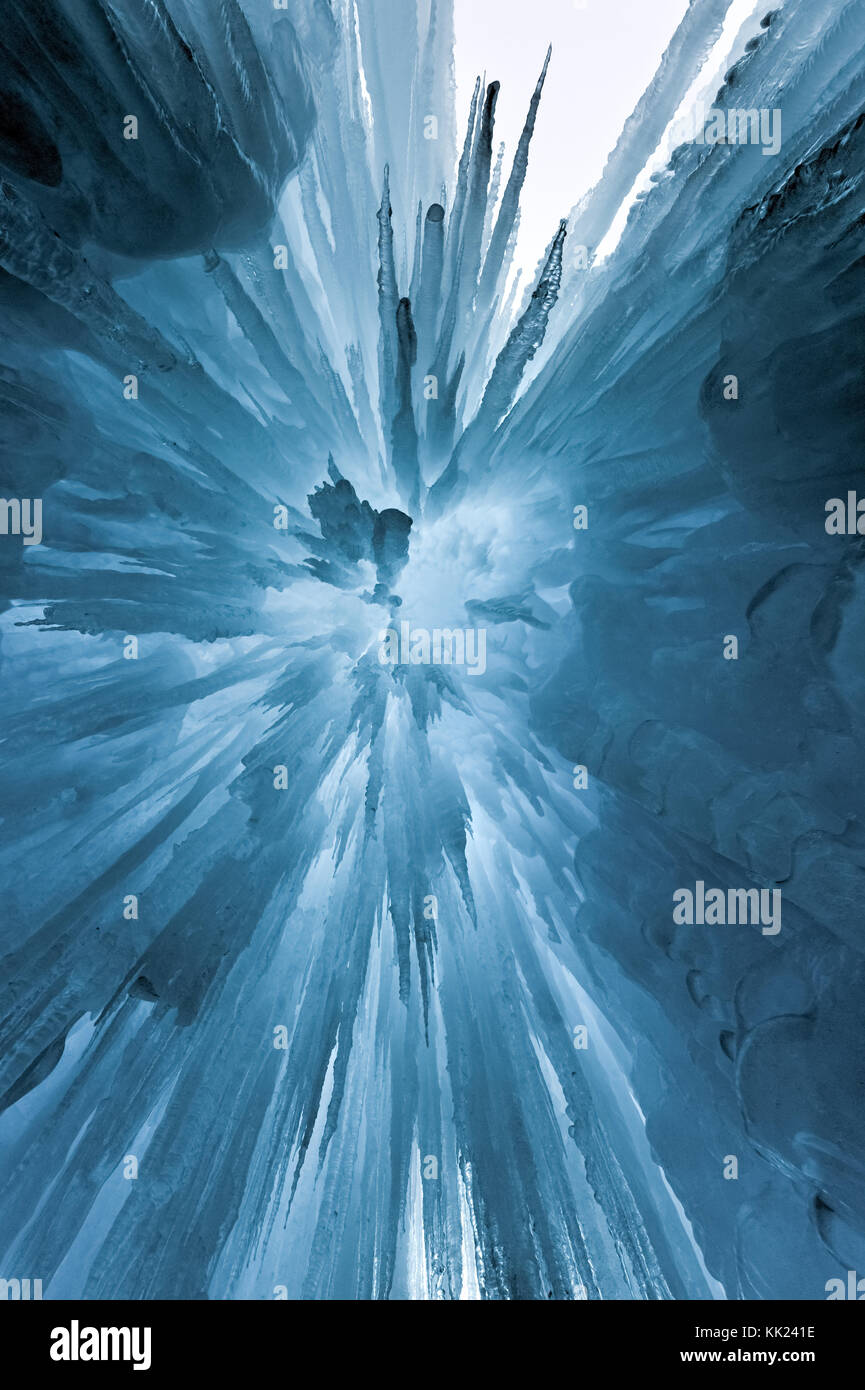 Translucent blue icicles in a frozen ice wall Stock Photo - Alamy