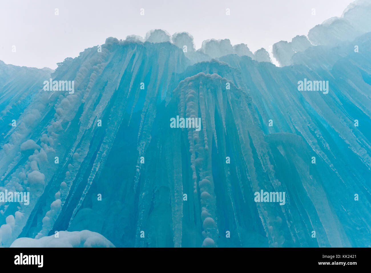 Translucent blue icicles in a frozen ice wall Stock Photo - Alamy