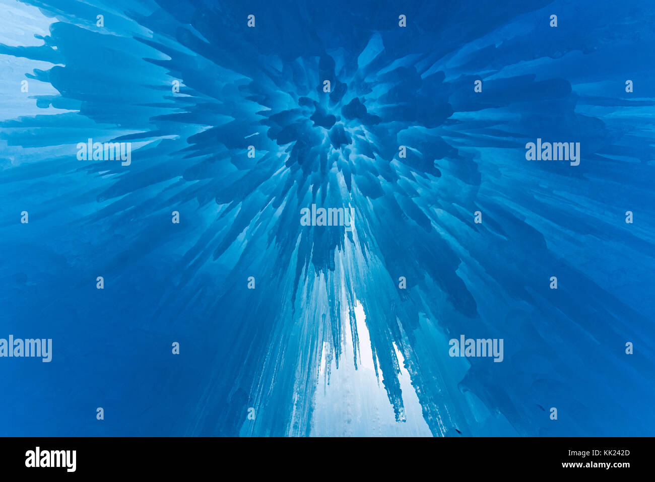 Translucent blue icicles in a frozen ice wall Stock Photo - Alamy