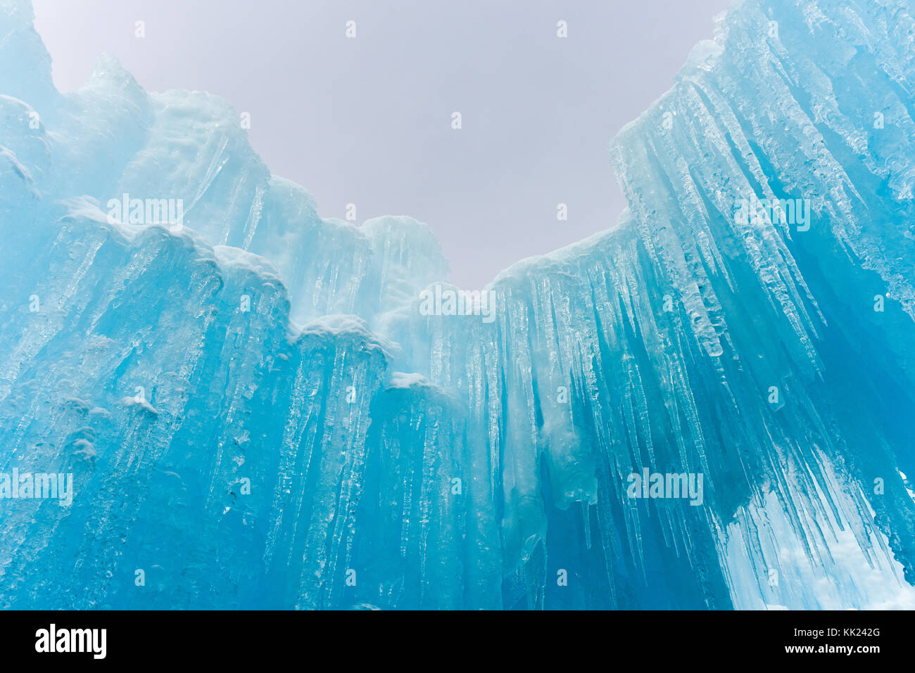 Translucent blue icicles in a frozen ice wall Stock Photo - Alamy