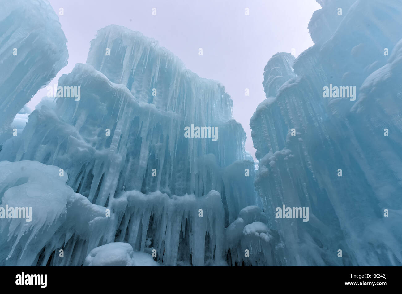 Translucent blue icicles in a frozen ice wall Stock Photo - Alamy