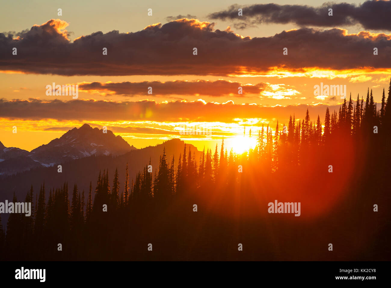 Sunset in mountains Stock Photo - Alamy