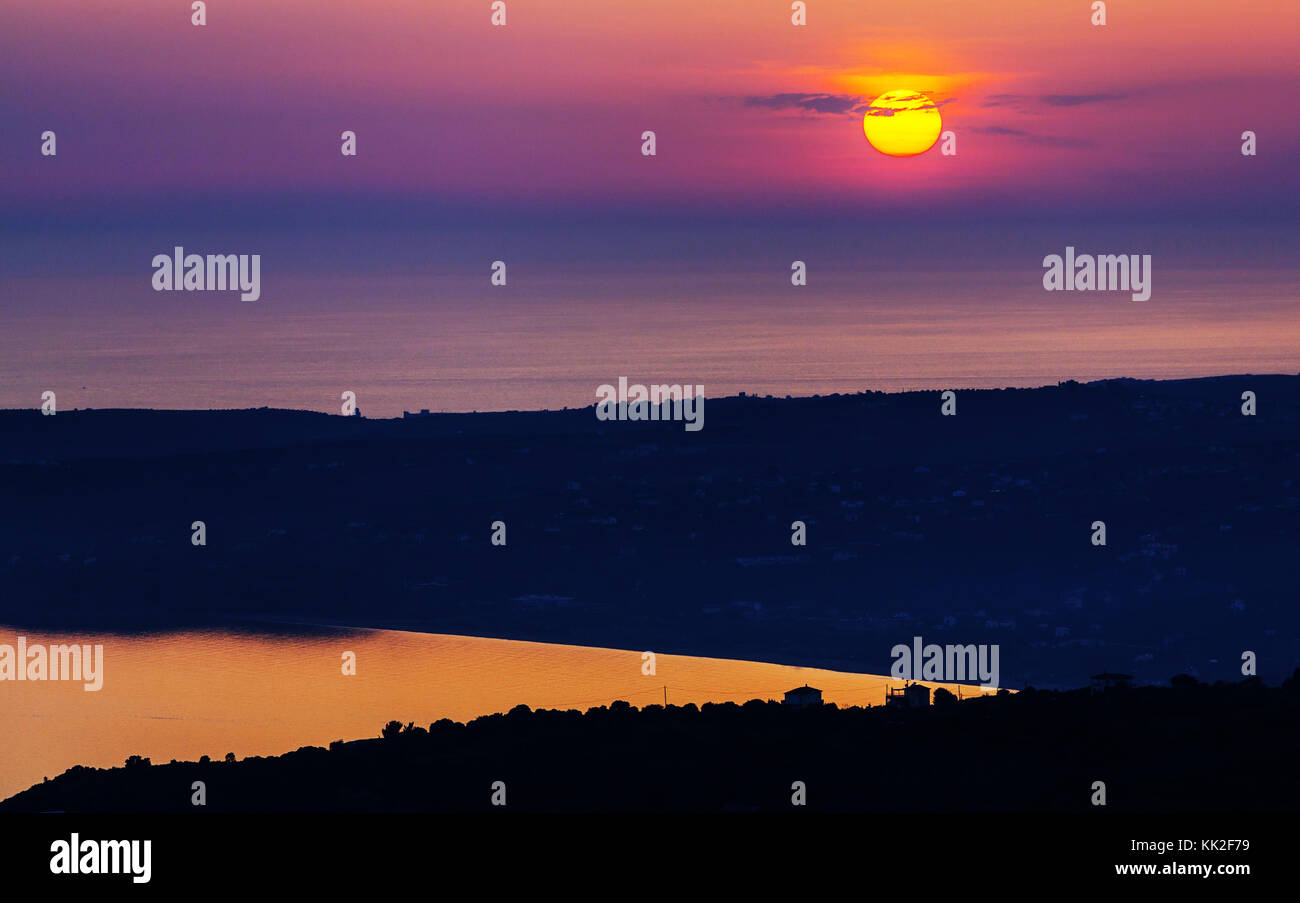 Beautiful sunset on Greek coast Stock Photo - Alamy