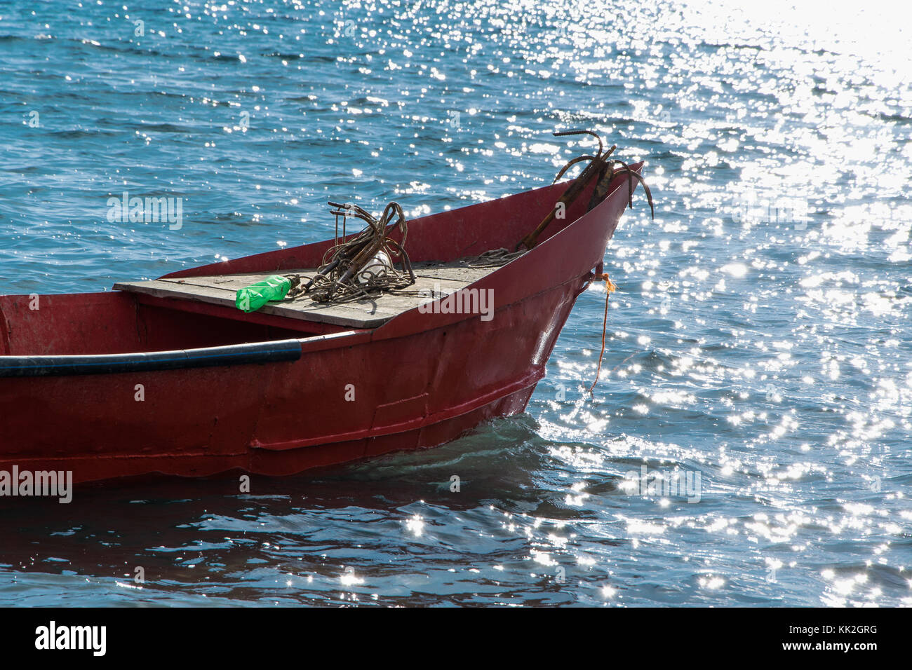 Red fishing boat in the water Stock Photo - Alamy