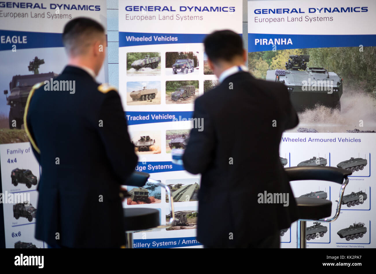 Berlin, Germany. 28th Nov, 2017. Visitors talking at the stand of the ...