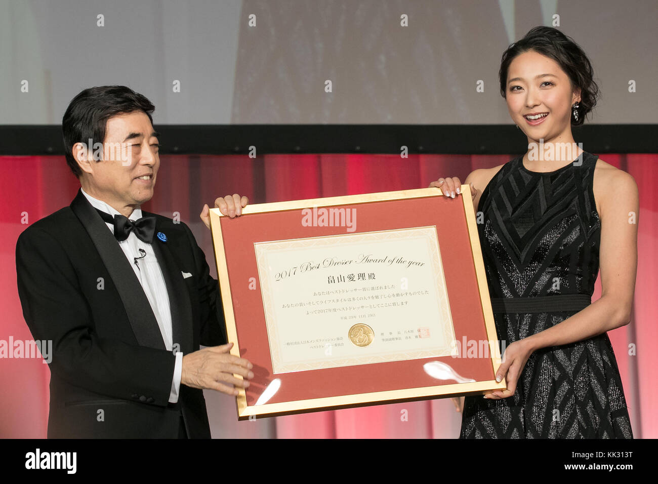 Japan's Best Dresser Awards winner Airi Hatakeyama (R) poses for the cameras during the 46th ...