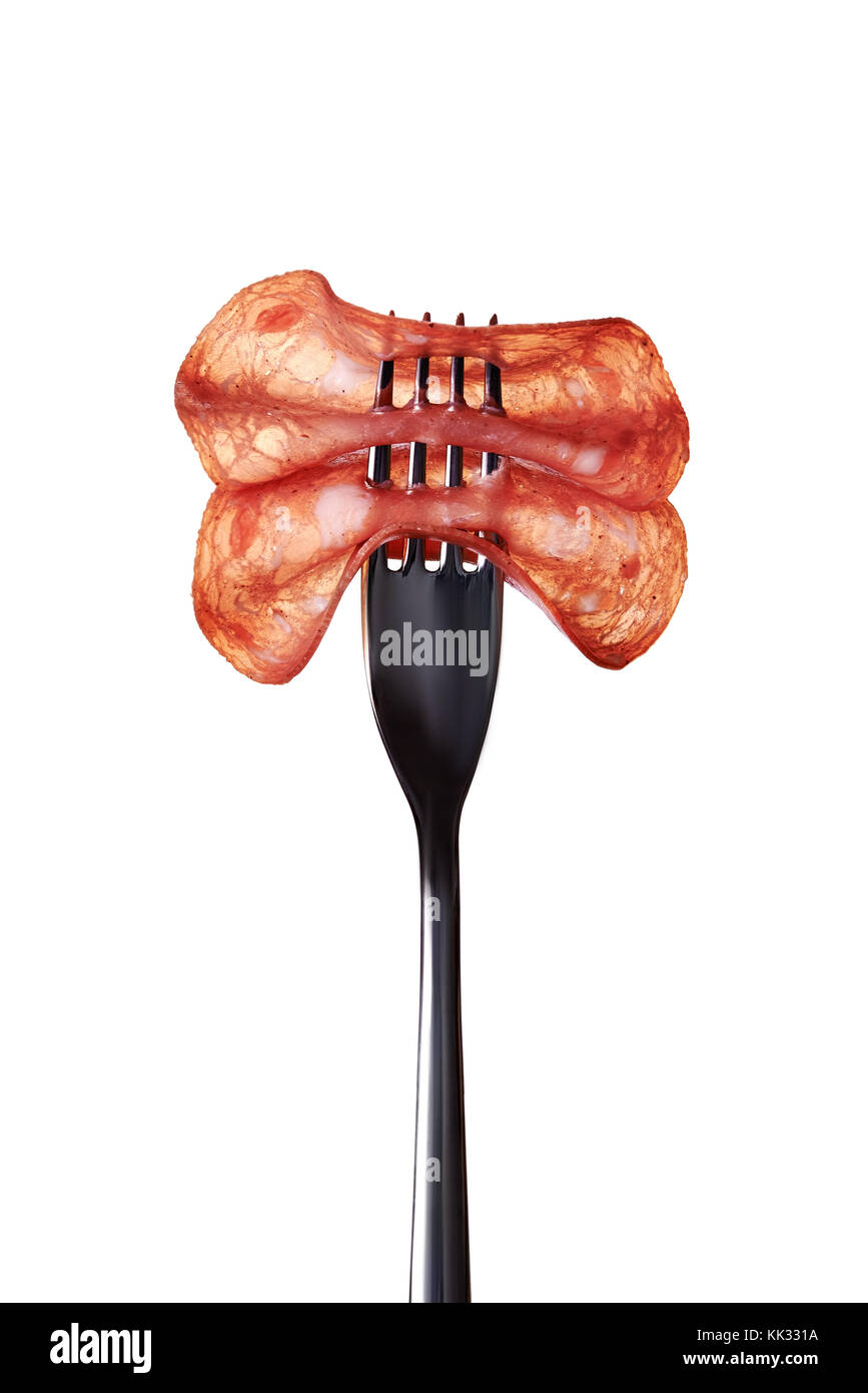 slice of meat on silver fork isolated on white background Stock Photo ...