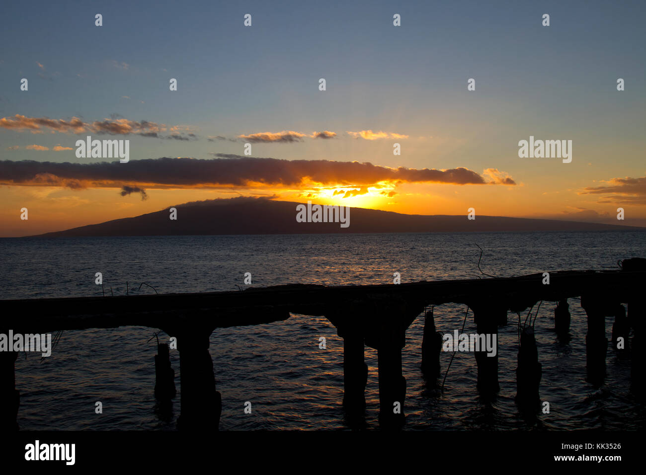 Sunset at Mala Harbor on Maui with a view of Lanai in the distance ...