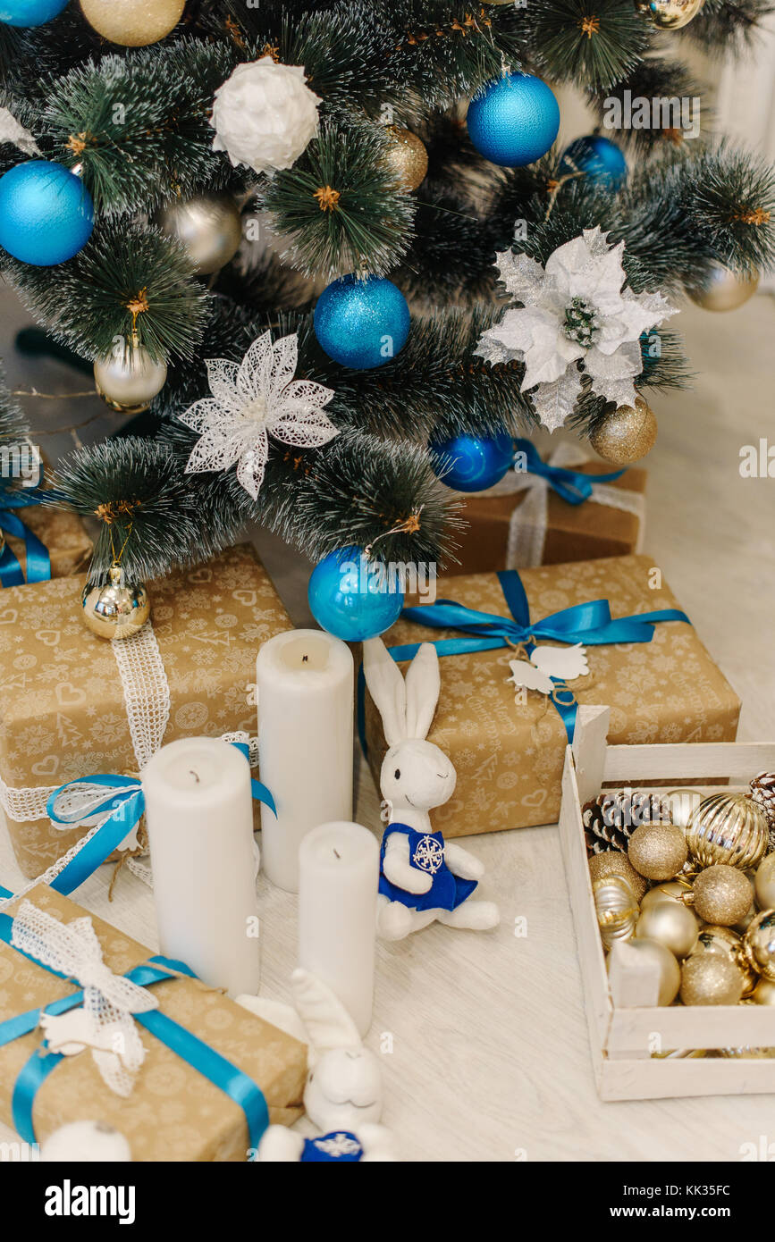 Brown present boxes decorated with ribbons stand under Christmas Stock ...