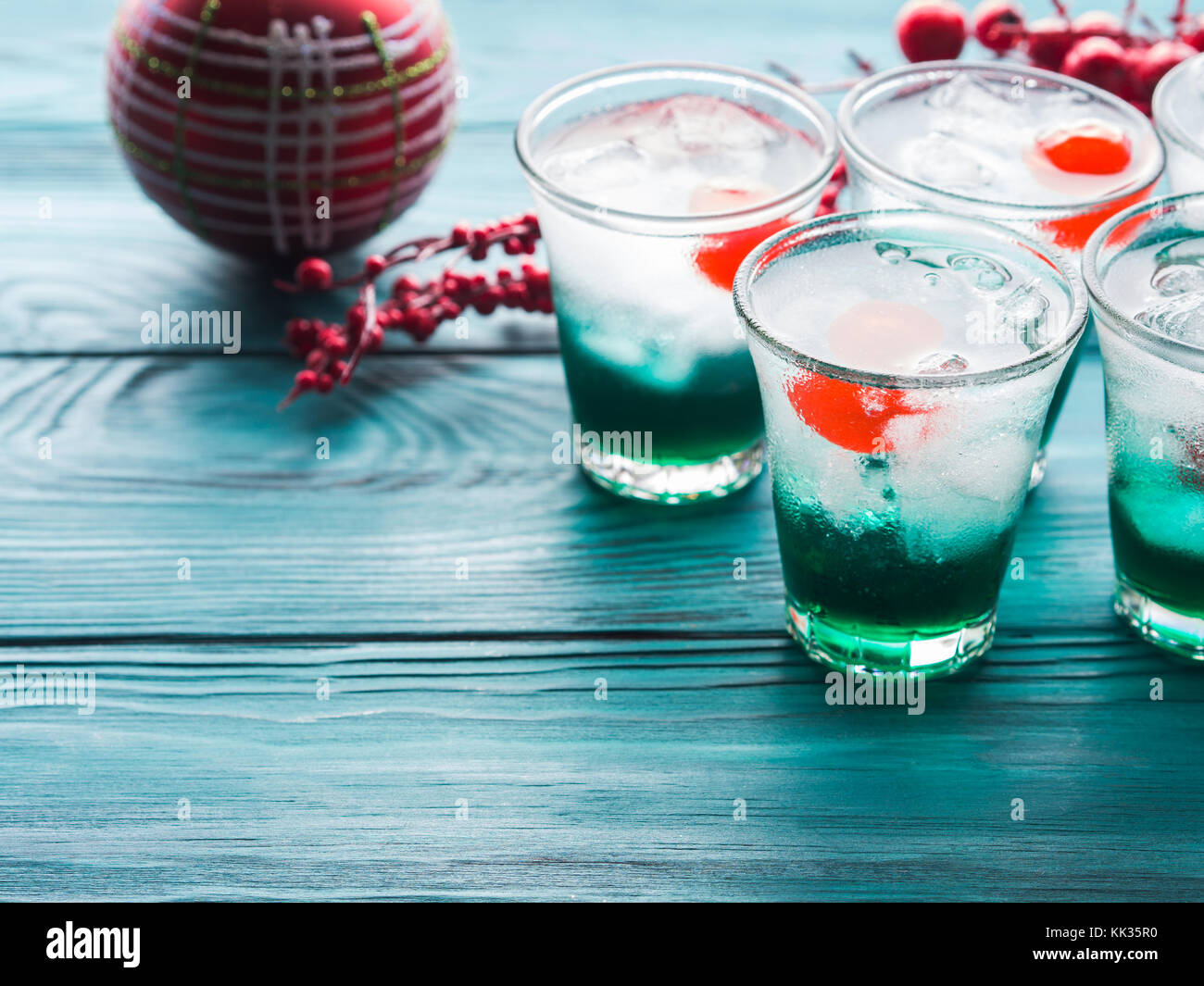 Christmas holiday party background with green alcohol drinks with ...