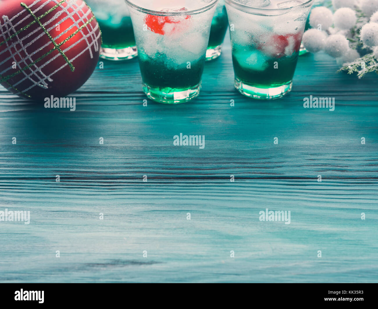 Christmas holiday party background with green alcohol drinks with ...