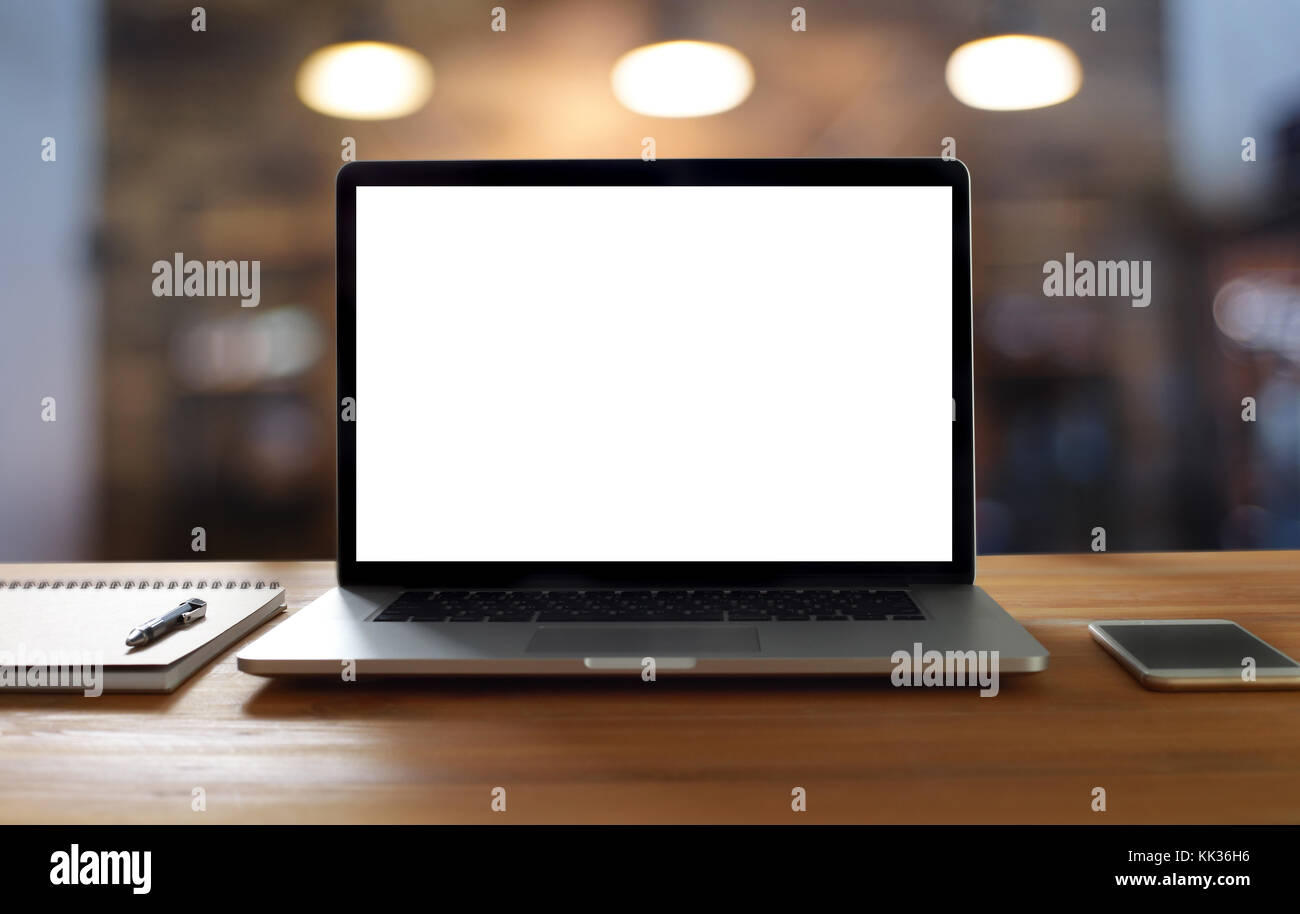 Laptop with blank screen on table. Workspace background new project on ...