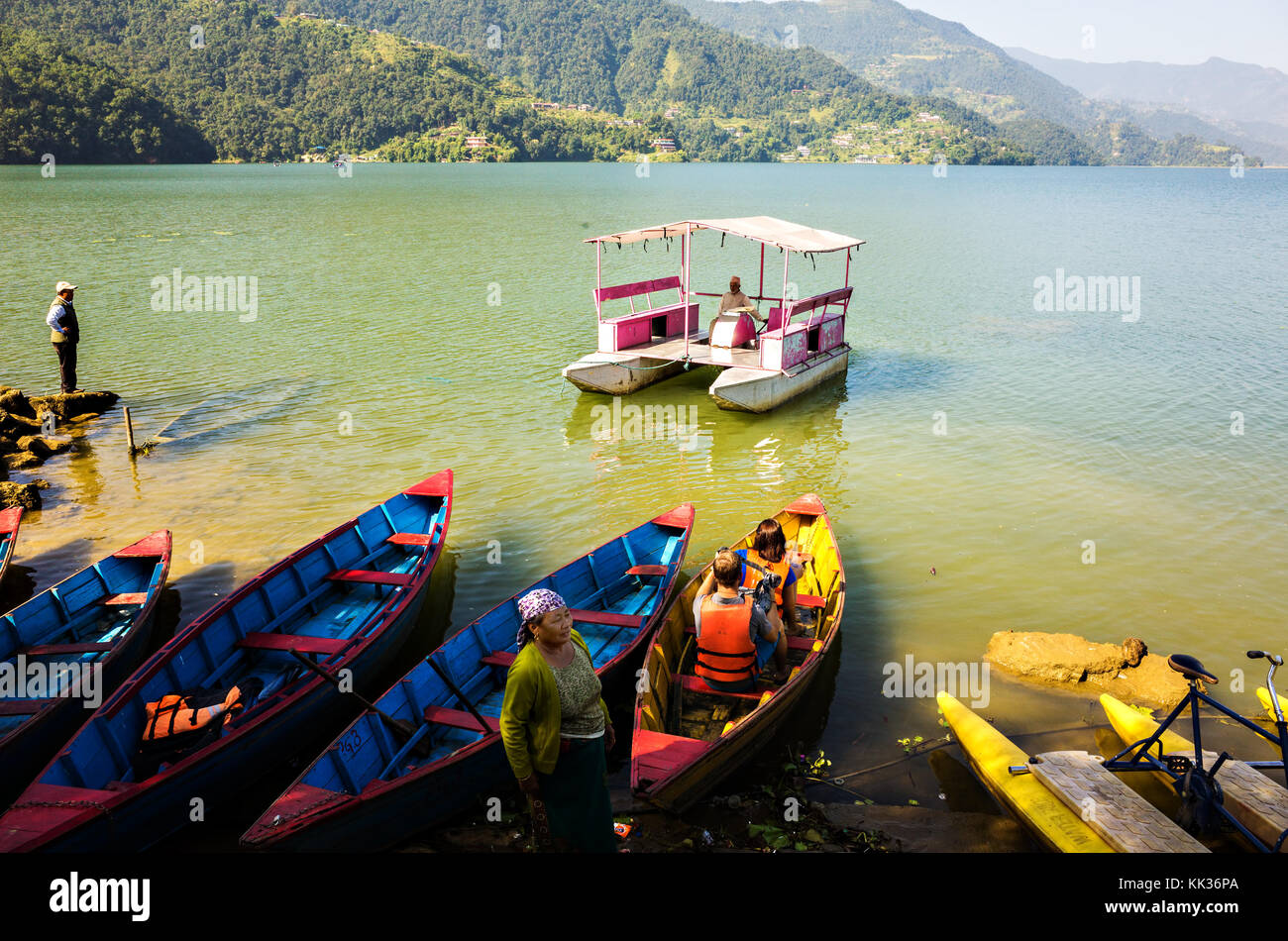 a couple of tourist preparing for a boat ride, Phewa Lake, Mid-Western ...