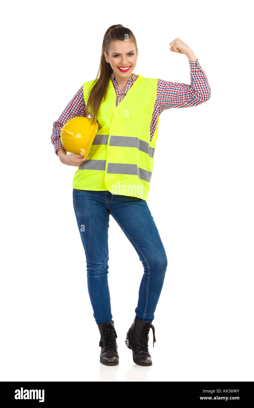 Woman flexing arm green shirt hi-res stock photography and images - Alamy