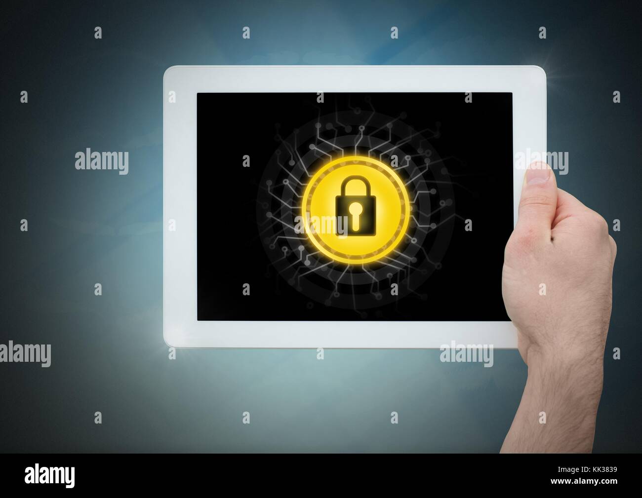 Digital composite of hand holding tablet and security lock icon Stock ...