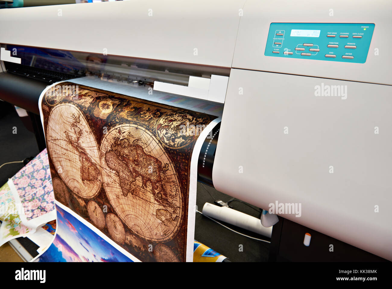 Big rolling plotter and old ancient map of world Stock Photo - Alamy