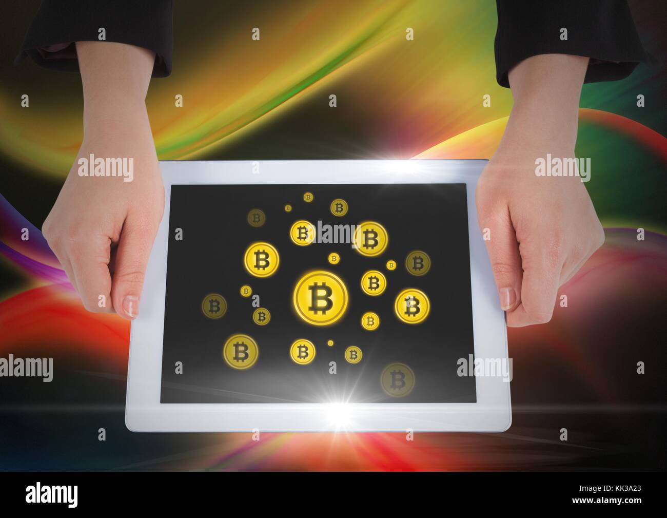 Digital composite of Bitcoin icons and hands holding tablet Stock Photo ...