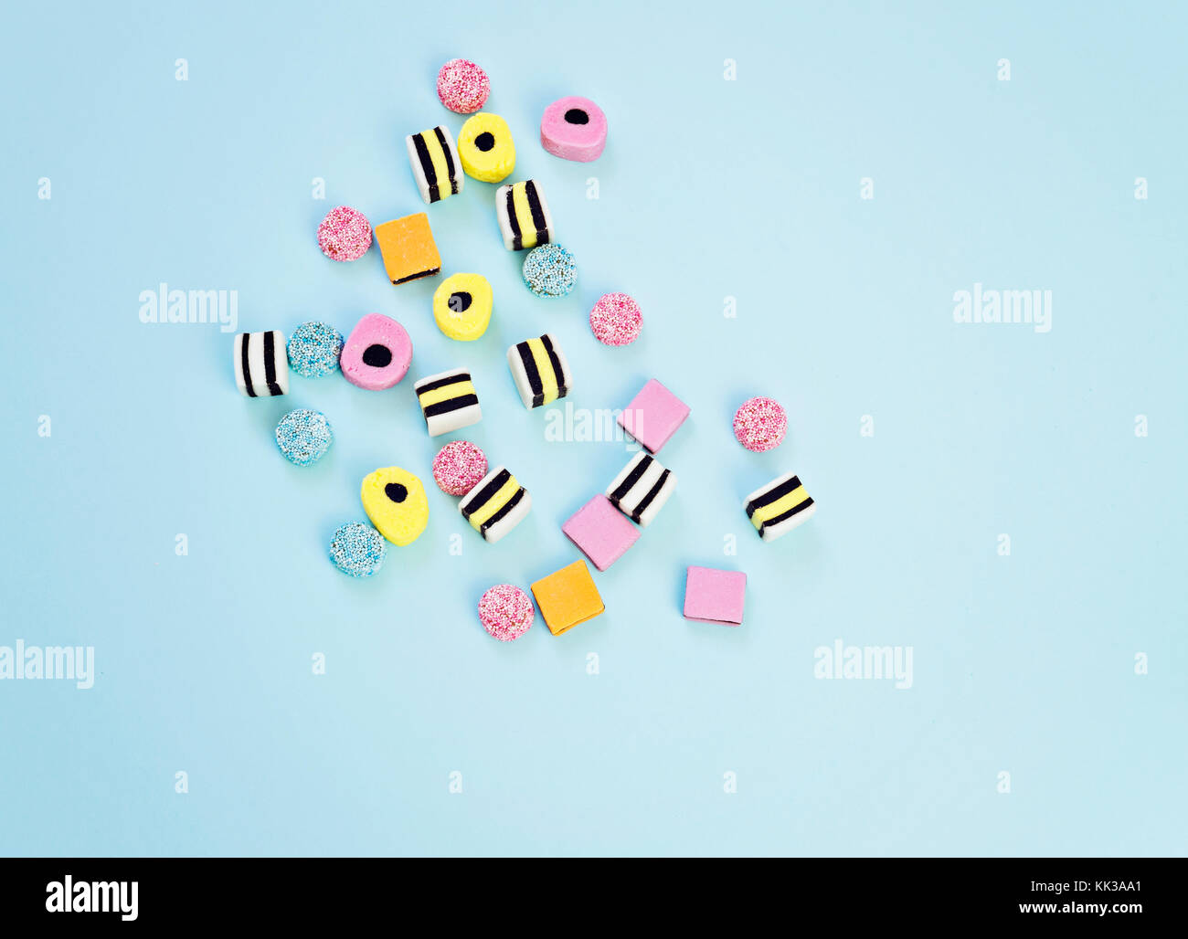 Colored chewing sweets on the blue background Stock Photo - Alamy