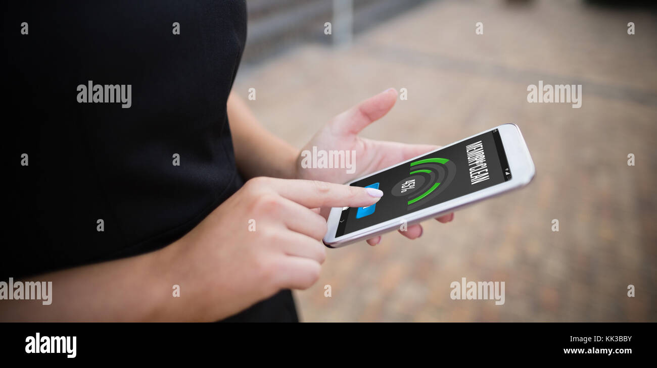 Mobile display with memory cleaner against businesswoman using mobile ...