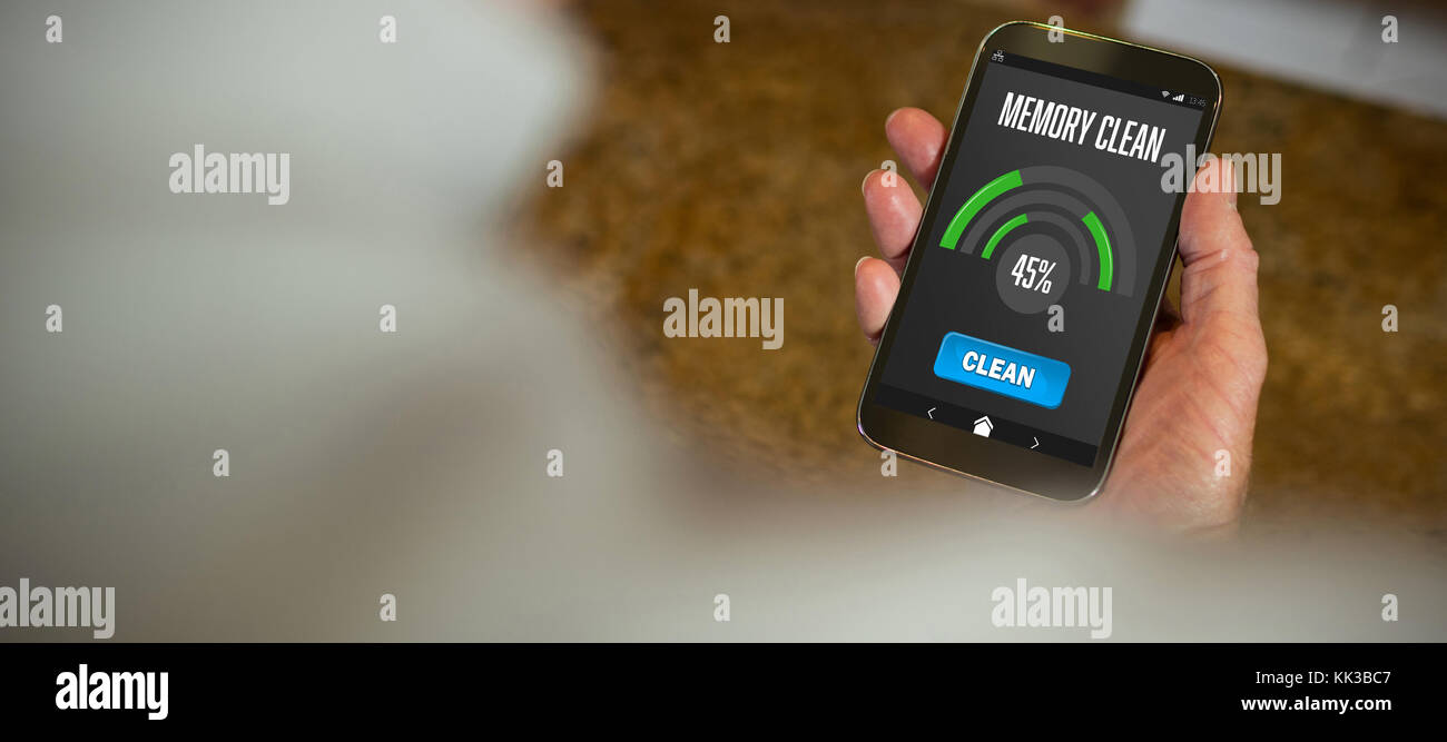 Mobile display with memory cleaner against cropped image of man holding ...