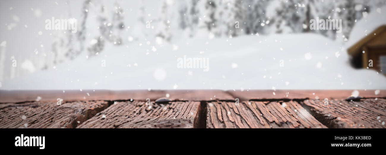 Snow falling against trees full of snow beside house Stock Photo - Alamy