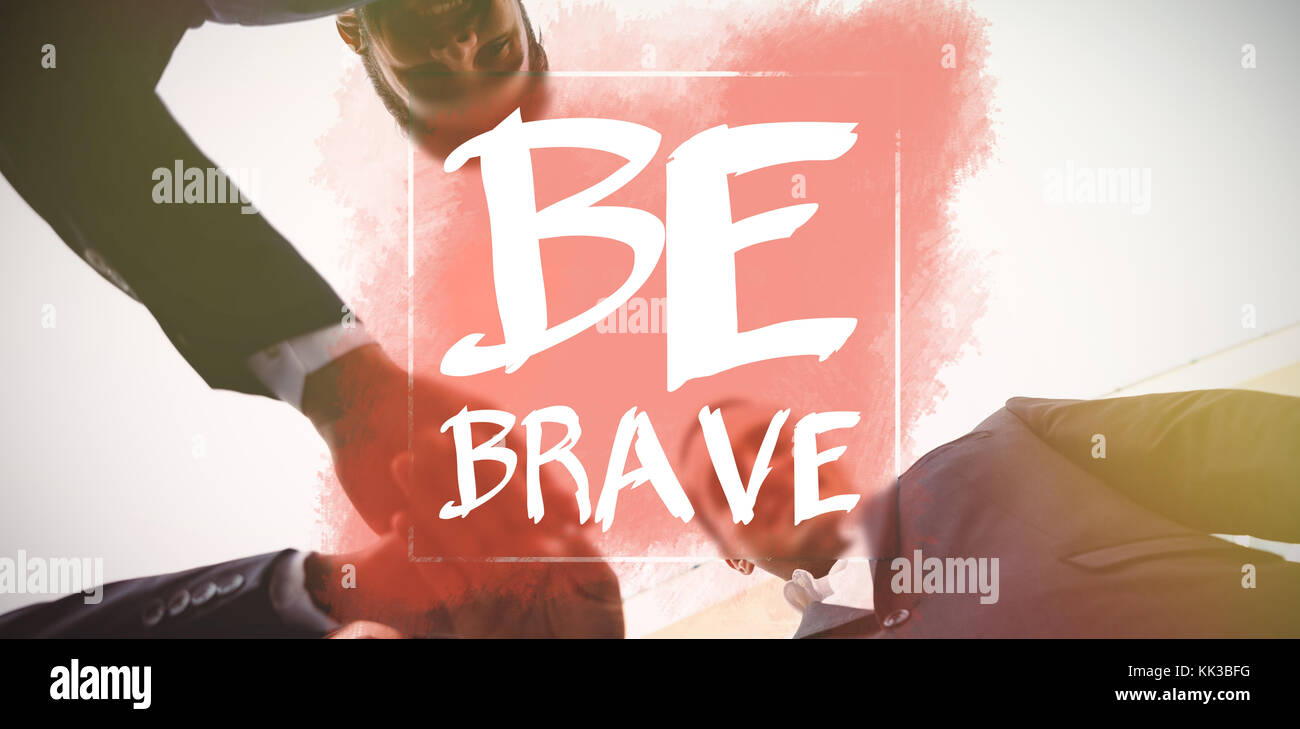 be brave against businesses executives forming a hand stack Stock Photo ...