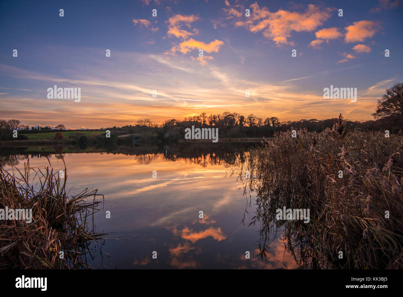 Evening sunset at Pebsham Lake and Reed Beds in Combe Valley ...