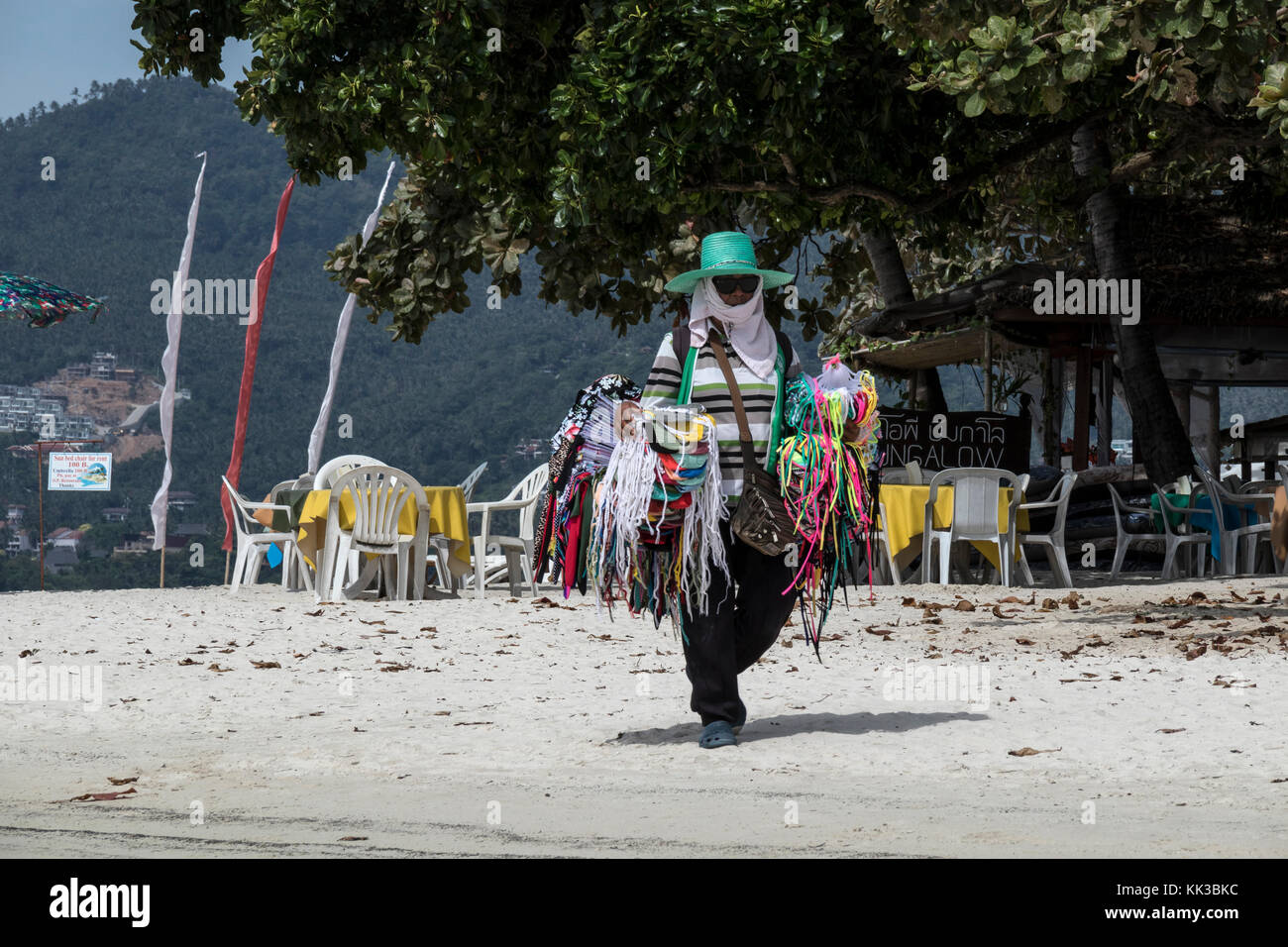 Beach trader selling hats on the beach at Chaweng, Koh Samui, Thailand ...