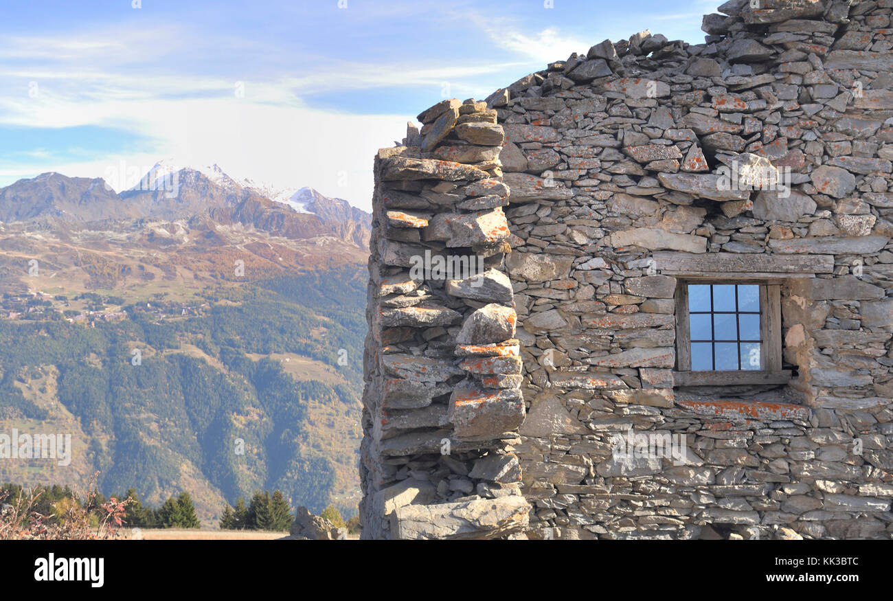 wall of ancient sheepfold in front of mountain landscape Stock Photo ...