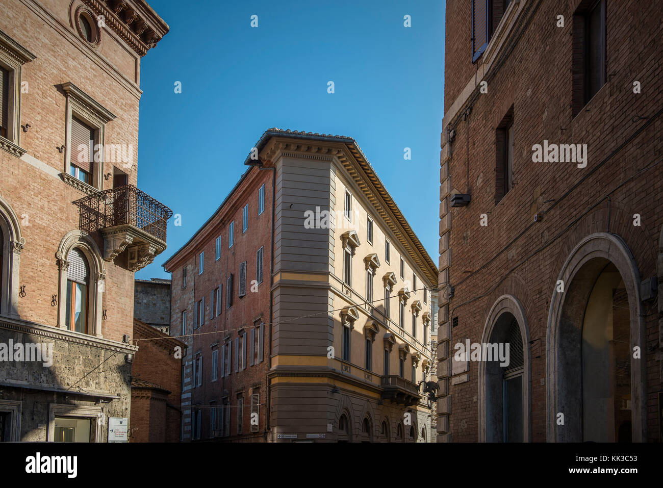 italian corner building with balcony Stock Photo - Alamy
