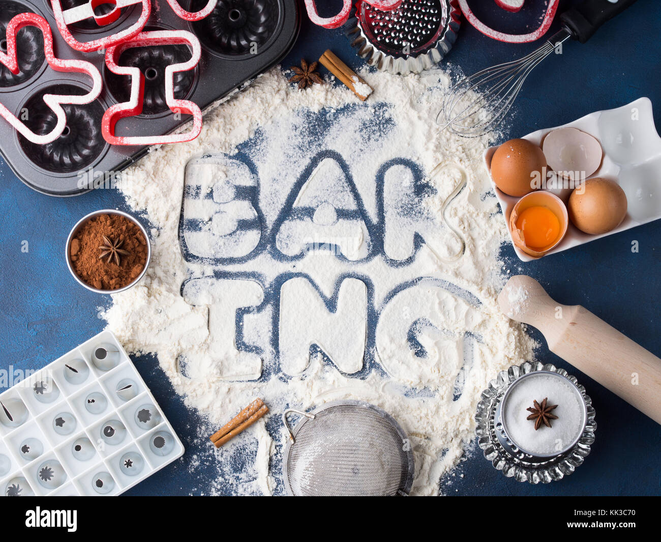 Flour letters spelling Baking with tools and sweet food ingredients ...