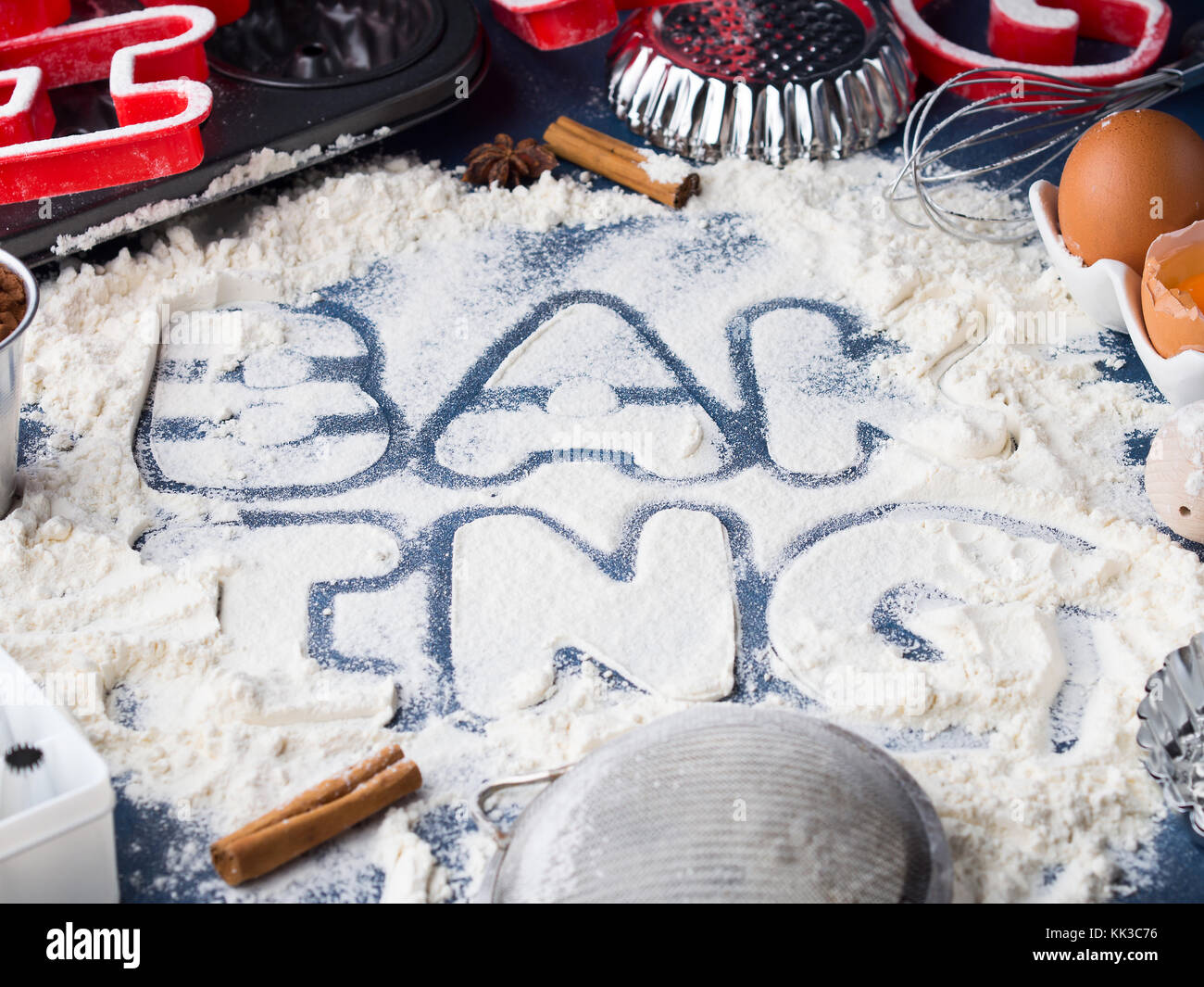 Flour letters spelling Baking with tools and sweet food ingredients ...
