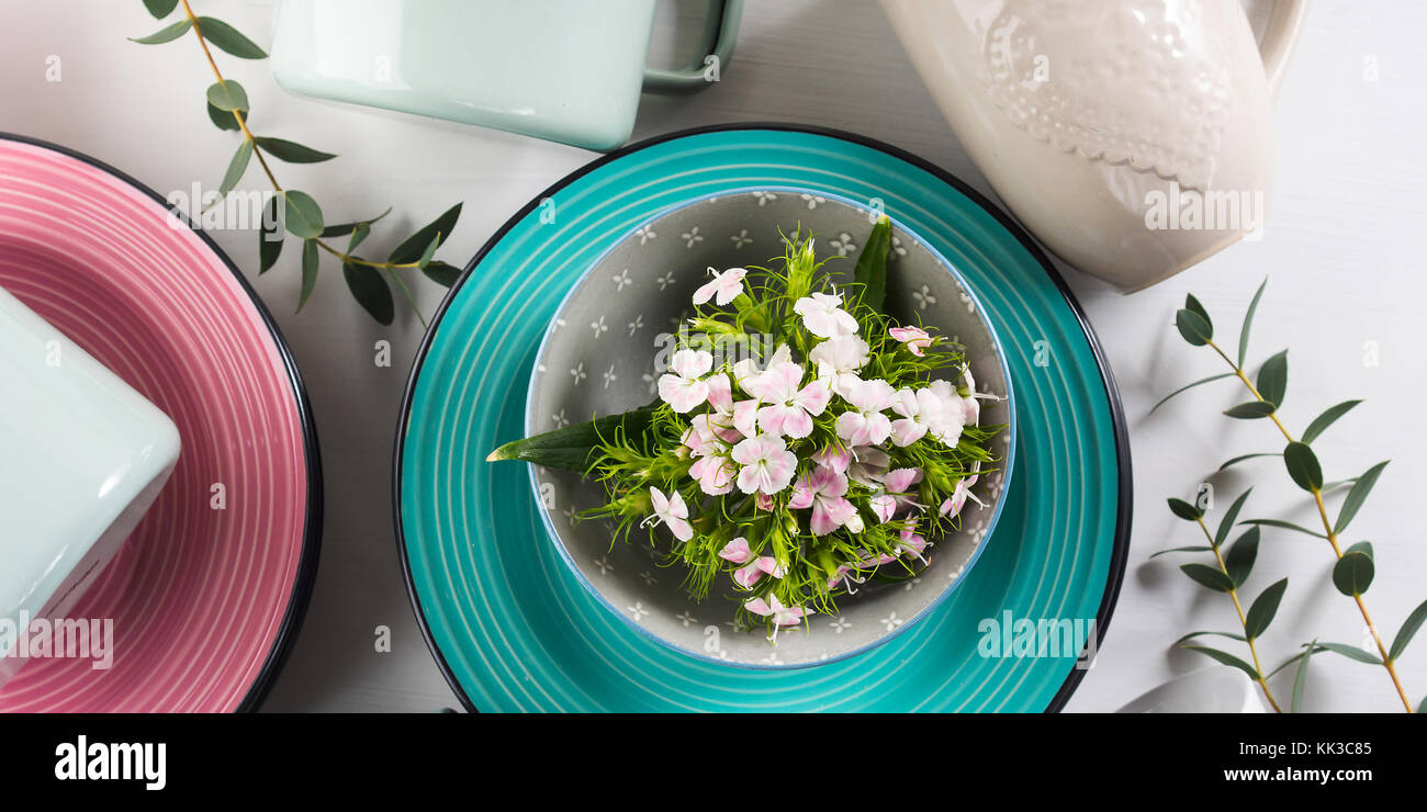 Spring tableware crockery concept with tulips flowers pastel color ...